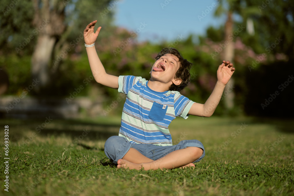 With arms flailing and tongue out, the boy exudes unrestrained energy ...