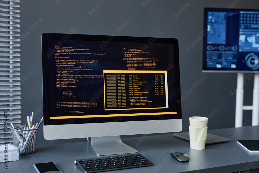 Desktop PC with text on screen on desk Stock Photo | Adobe Stock