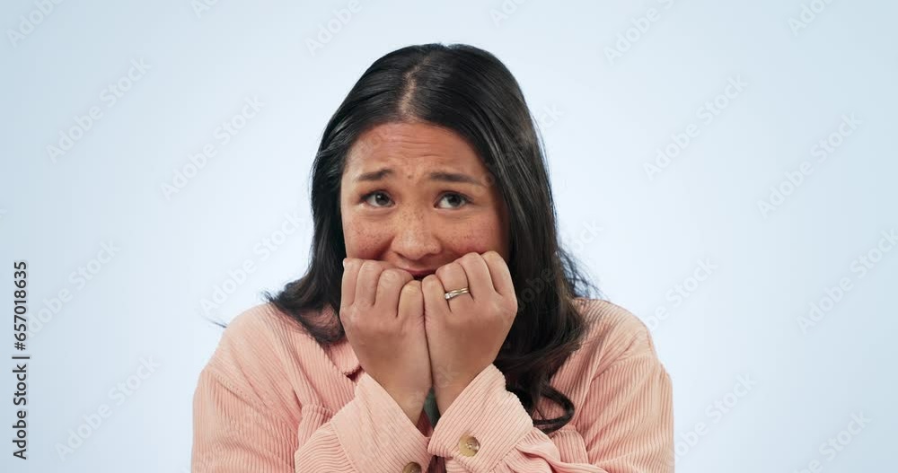 Nervous, anxiety and woman with fear, scared and depression on a blue ...