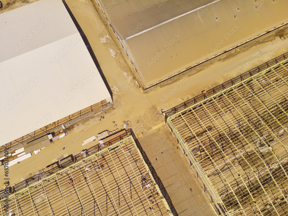 Factory under construction. Aerial drone photo of a factory being built ...