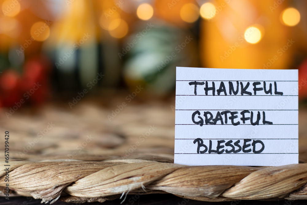 Thankful, grateful, blessed, handwritten text on lined paper note with ...
