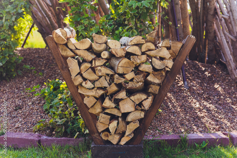 Pile of firewood. Preparation of firewood for the winter and use for ...