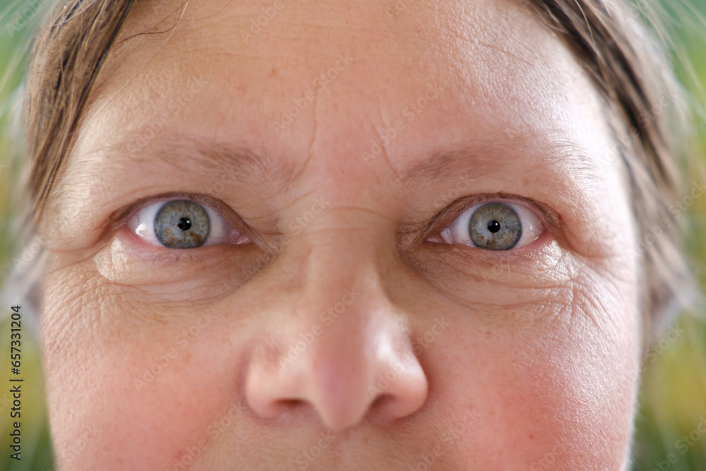 close up part of mature female face, woman 50 years old, human eyes ...