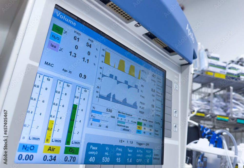 Medical monitor displays vital signs with graphs and numbers, heart ...