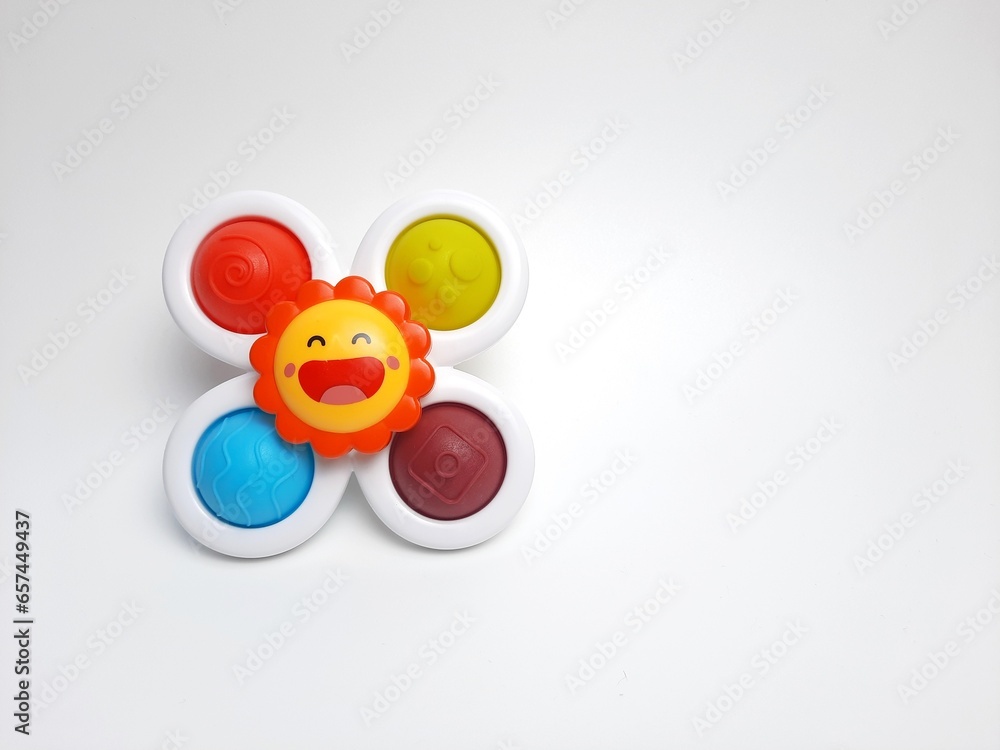 Children's fidget spinner with sunflower character isolated on white ...