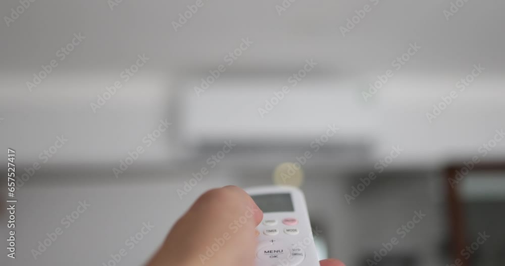 Silhouette part of person body. Human hand uses remote control, presses ...