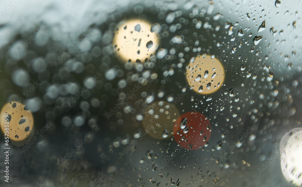 Raindrops on windowpane during a rainy day, capturing the tranquility ...