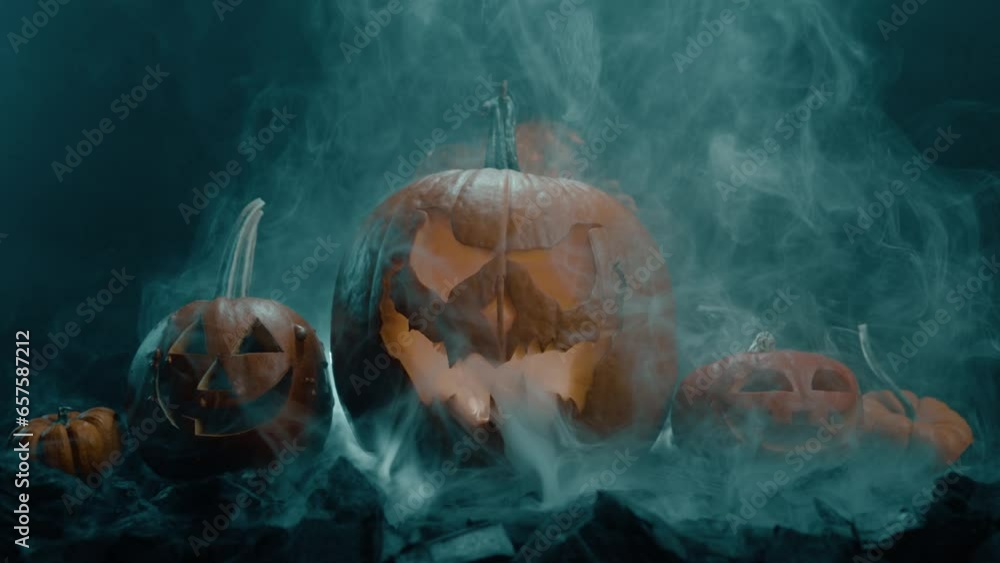 Halloween pumpkin on fire glowing inside in the dark. Scary Pumpkin ...