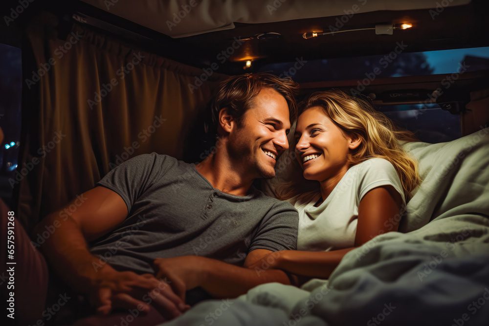 Couple in bed in van with backlight. Road trip concept, couple living ...
