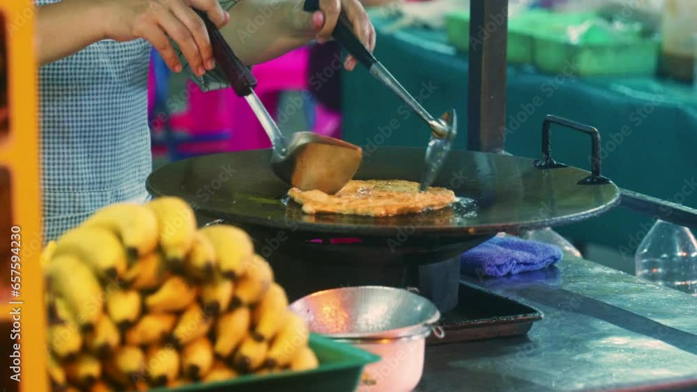 4K Cinematic cooking footage of a Thai chef preparing a traditionnal ...