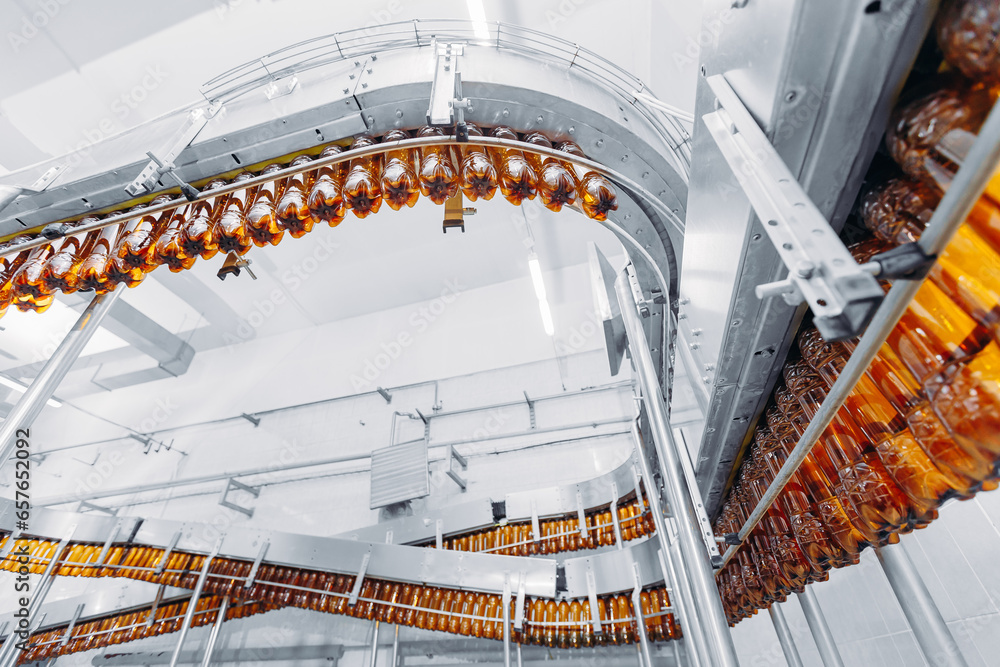 Concept modern production line of brewery industry. Conveyor with brown ...