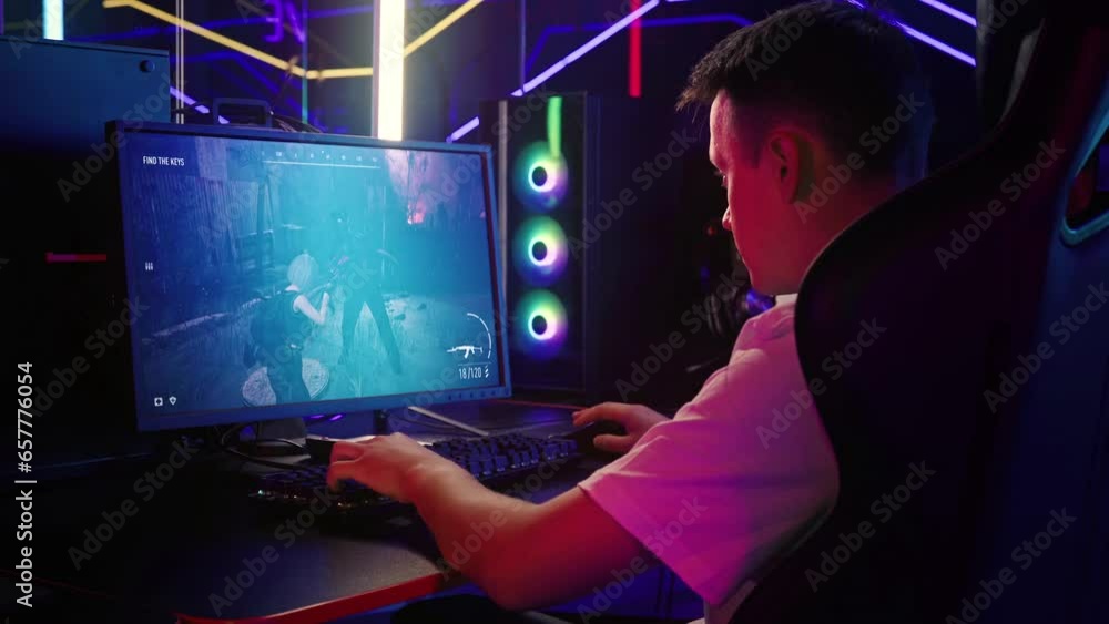 Gamer playing the zombie apocalypse computer fake game. Gamer using a ...