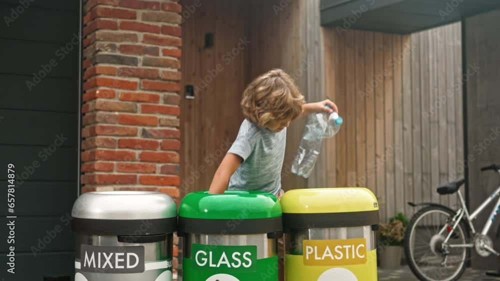 Young Caucasian boy holding bottle and plastic in hands and throwing ...