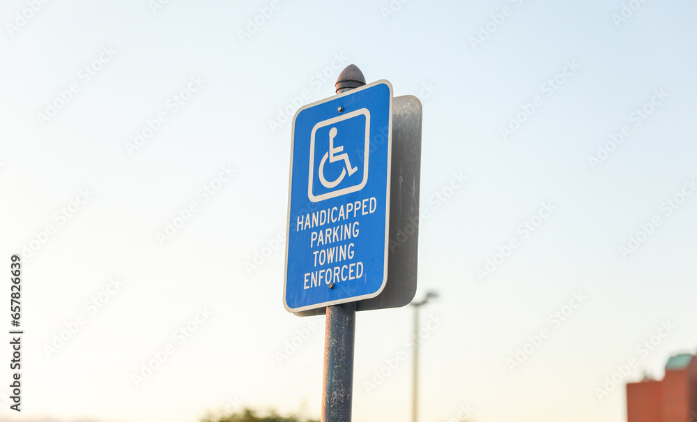 handicap wheelchair-accessible sign against a blurred background ...