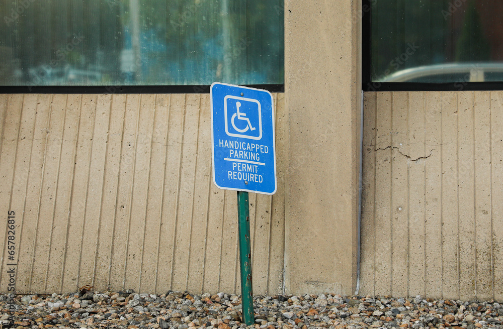 handicap wheelchair-accessible sign against a blurred background ...