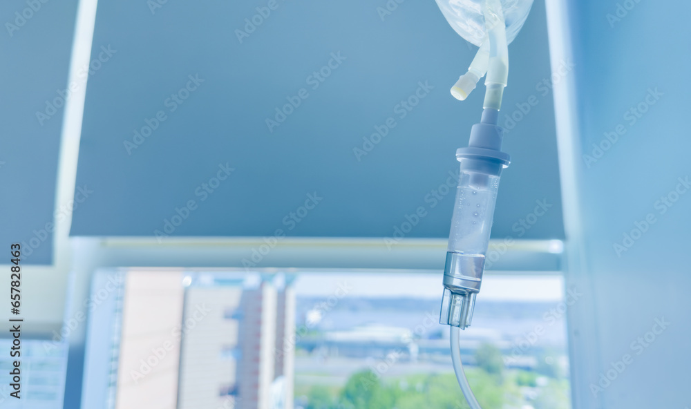 hospital IV drip, with translucent tubing and liquid medication flowing ...