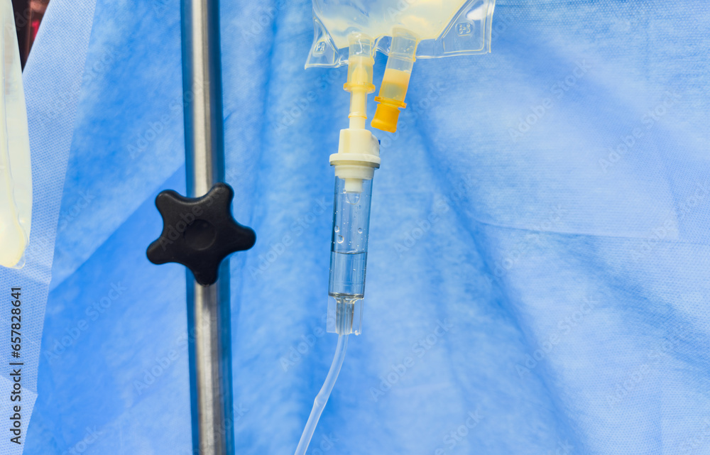 hospital IV drip, with translucent tubing and liquid medication flowing ...