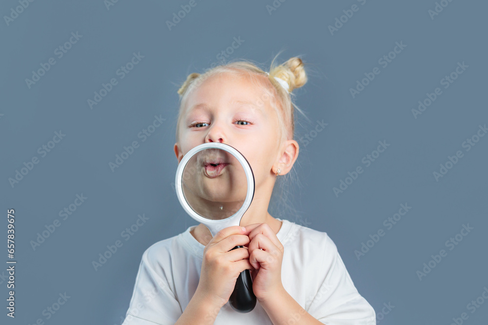 Investigation, discovery and vision concept - happy curious little girl ...