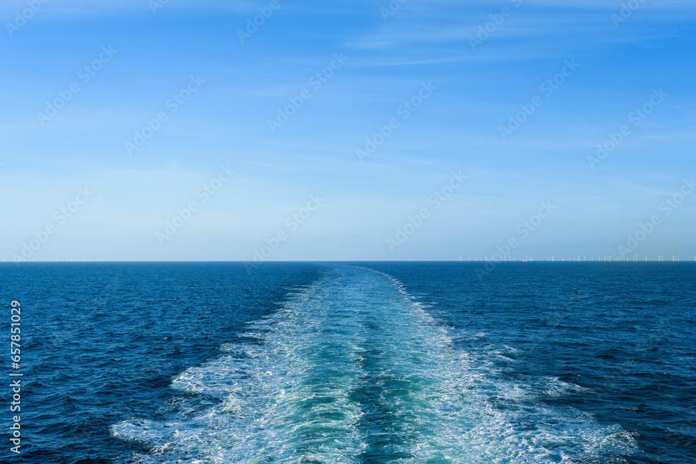 Churned water of a ship's wake in the North Sea at IJmuiden in the ...