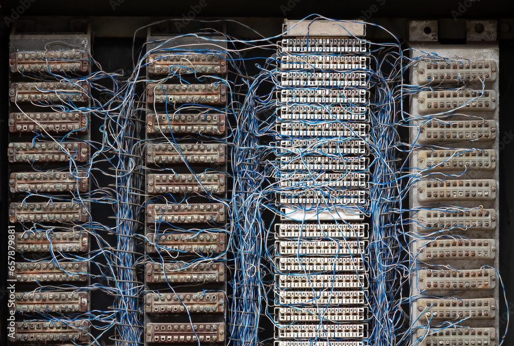 A look inside an old telephone wiring closet. Many contacts are ...
