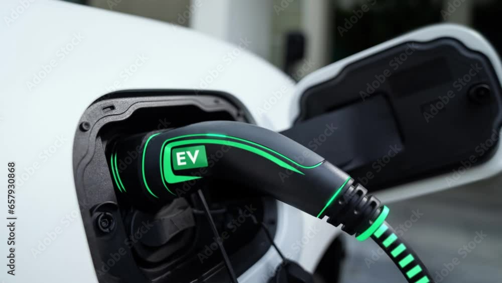 Electric car recharging in futuristic home charging station with smart ...