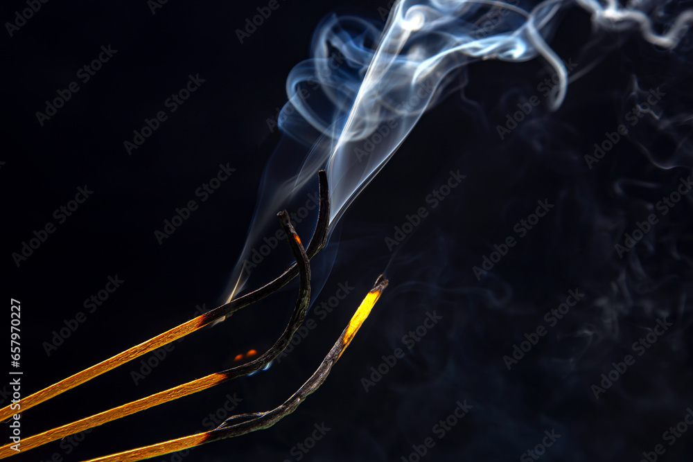 smoking match on a black background. Heat and light from fire flame ...