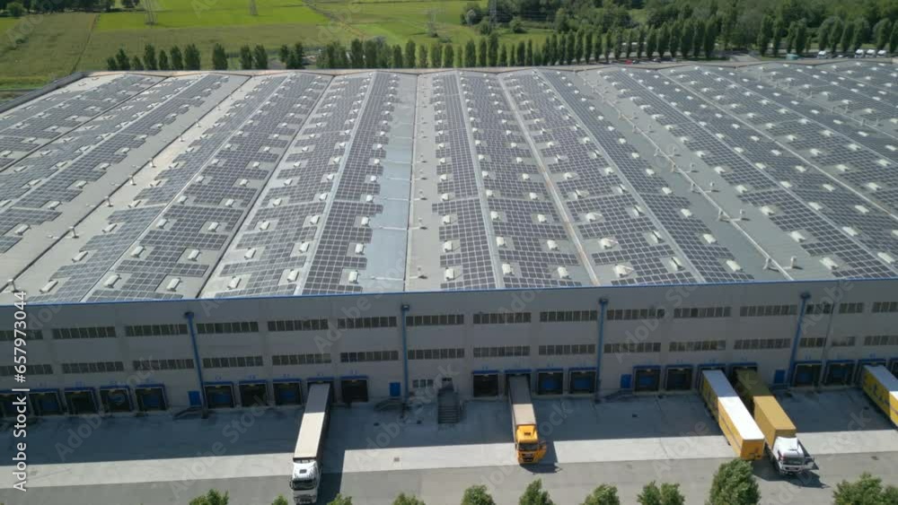 Aerial top view of solar panel modules installed in long straight rows ...