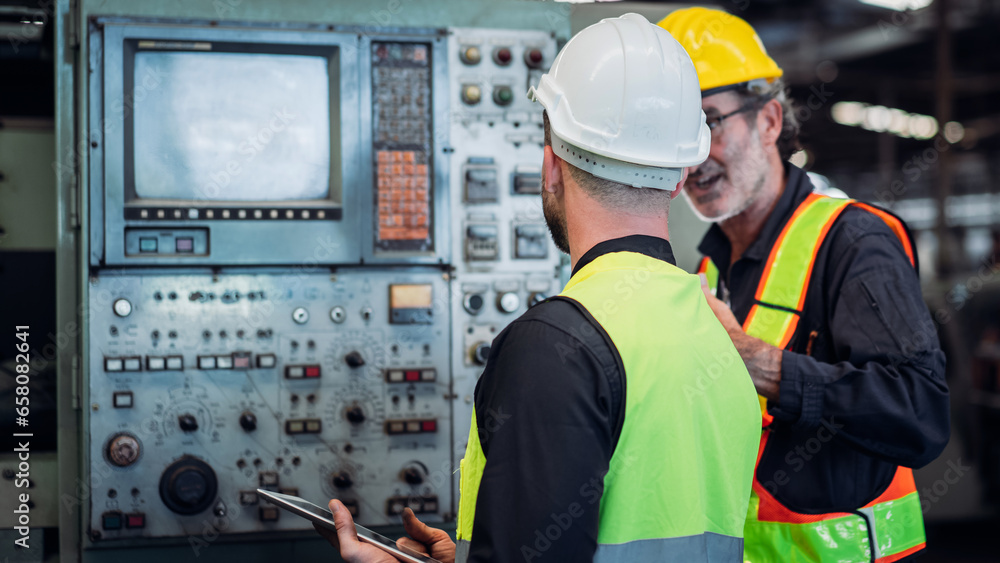 Mechanical Engineering Team Operating Machinery in a Manufacturing ...