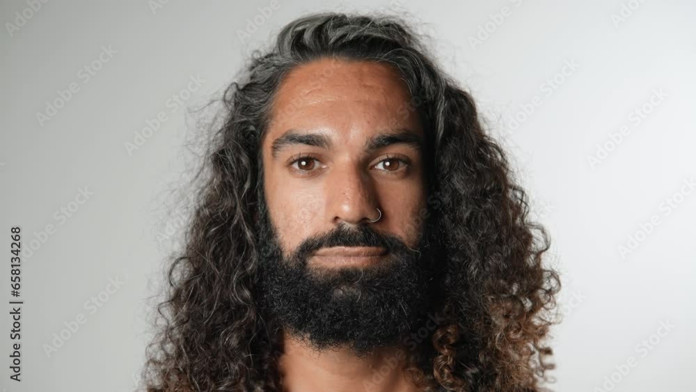 Handsome person look at camera close up. Young adult man face portrait ...