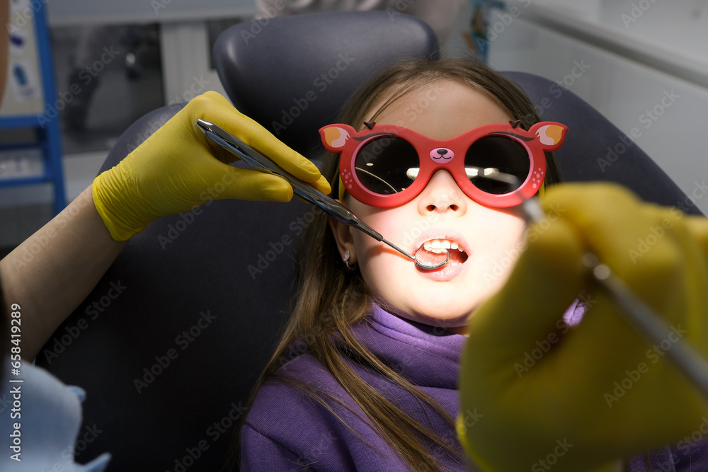 pediatric dentistry close-up little girl opened mouth shows teeth ...