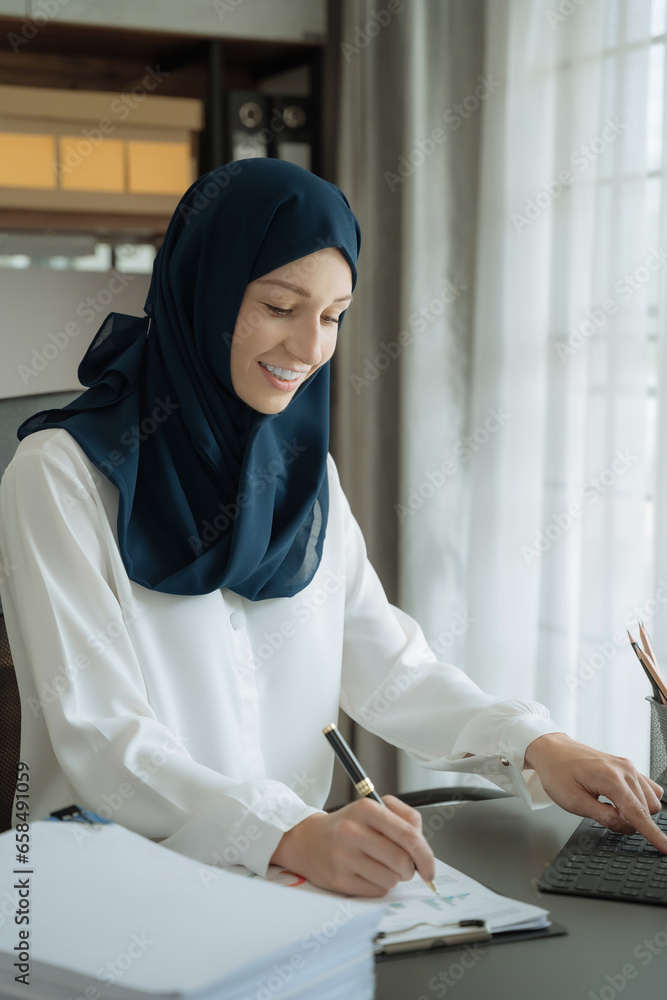 muslim business woman wearing hijab checking working schedule plan at ...