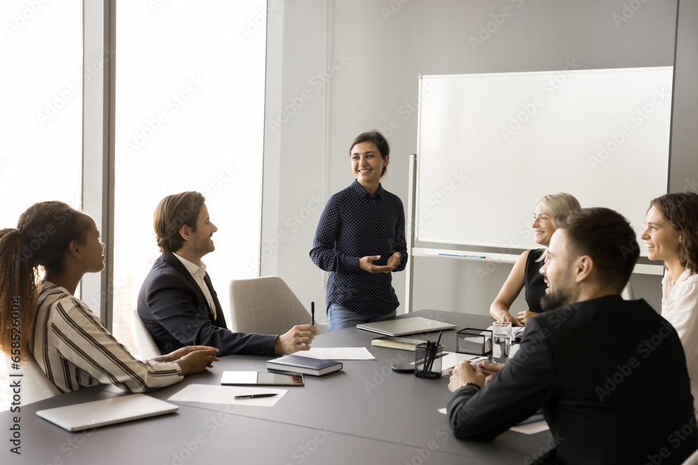 Happy creative multiethnic team of employees working on project ...