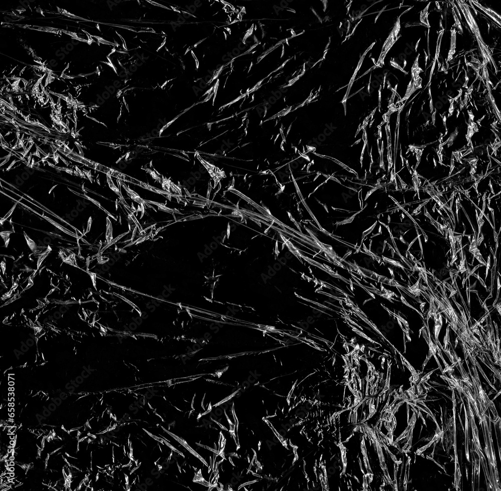 Wrinkled plastic wrap texture on a black background wallpaper. Royalty ...