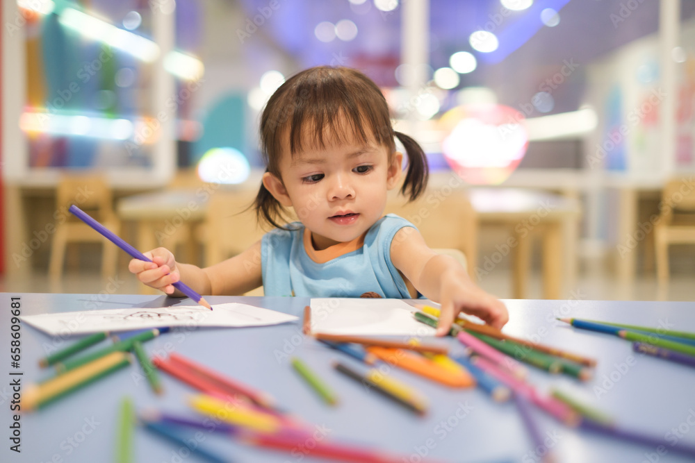 Happy cute baby child girl do crayon on paper. Little kid joy to learn ...