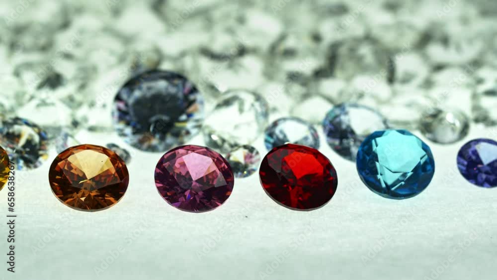 ..different types of diamonds are arranged in a row in front of a pile ...