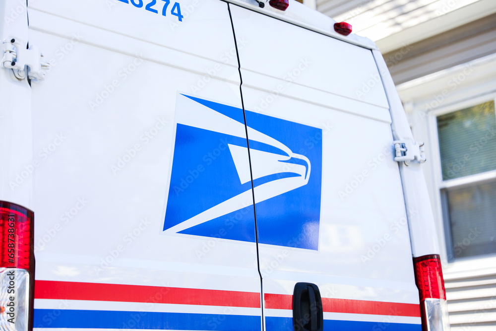 Boston, MA, USA, October, 7th 2023, USPS sign and mailbox and truck on ...