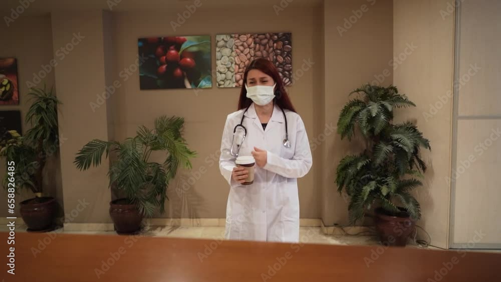 Exhausted Doctor Taking a Break and Sipping Coffee After Removing ...