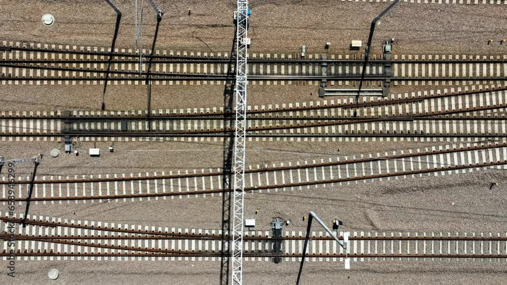 Parallel railroad tracks on the gravel with concrete railroad ties ...