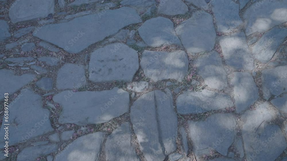 Stone path texture in urban park illuminated by sunlight. Pavement from ...