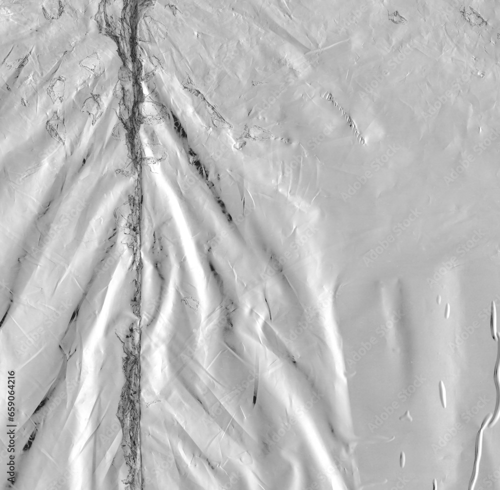 Wrinkled plastic wrap texture on transparent background wallpaper ...