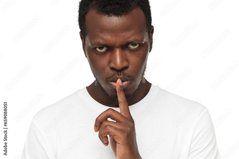 Close-up shot of angry african american man with shhh gesture, asking ...
