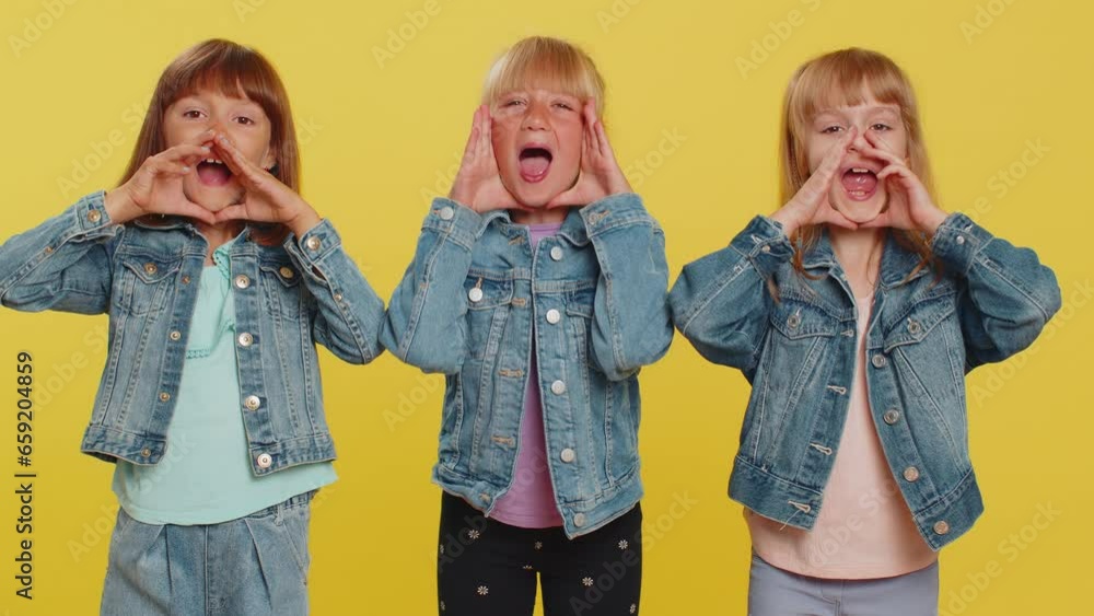 Expressive teenage girls holding hands near mouth loudly screaming ...