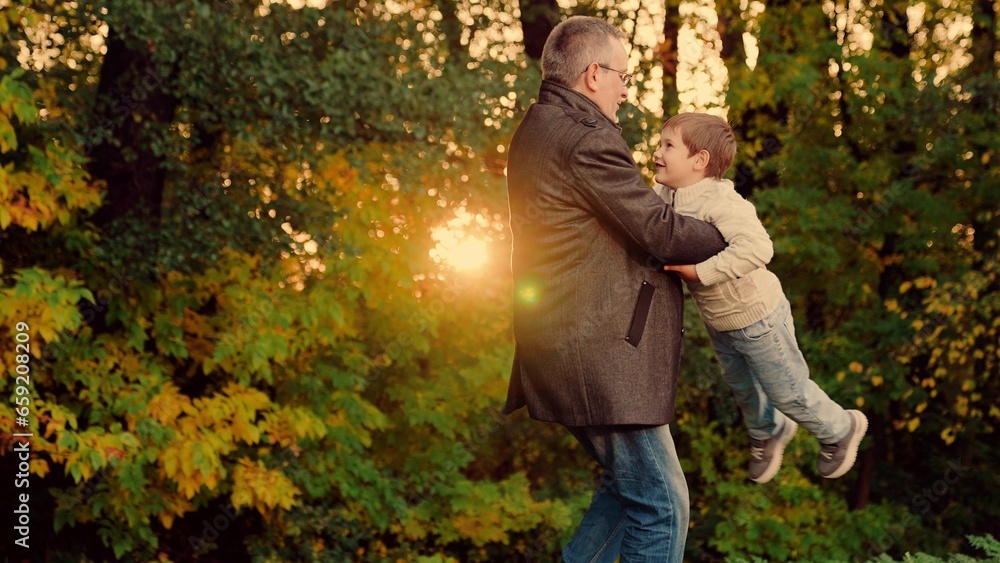 Child, son runs to his Father, hugs her in autumn park, Twirl kid round ... Child, son runs to his Father, hugs her in autumn park, Twirl kid round ...