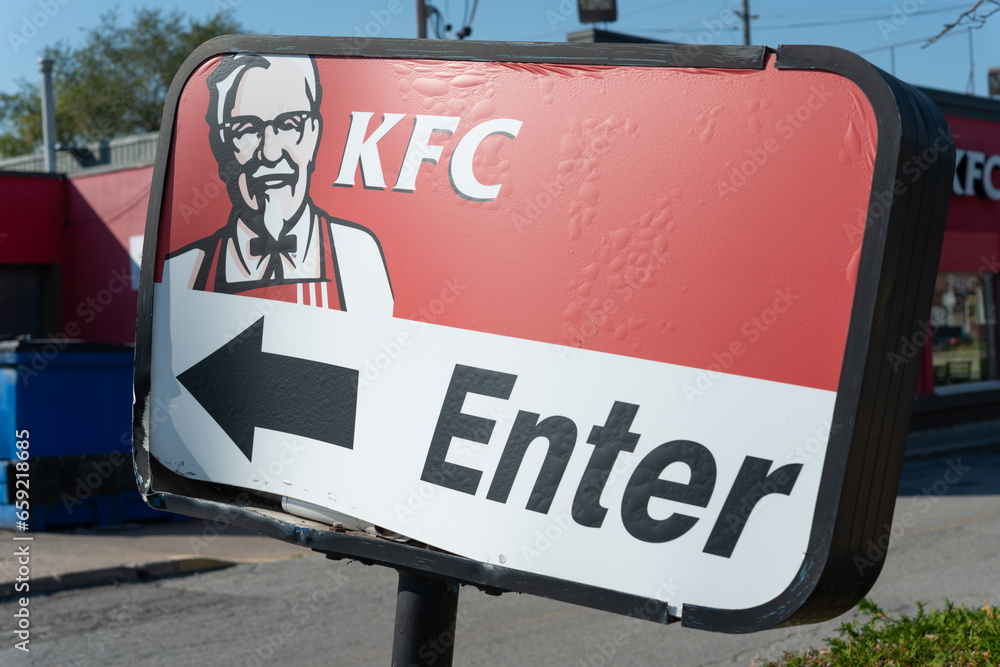 parking lot entrance sign for KFC (Kentucky Fried Chicken) located at ...