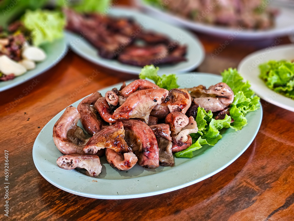 Grilled pork intestine served with spicy sauce, Northeastern region of ...