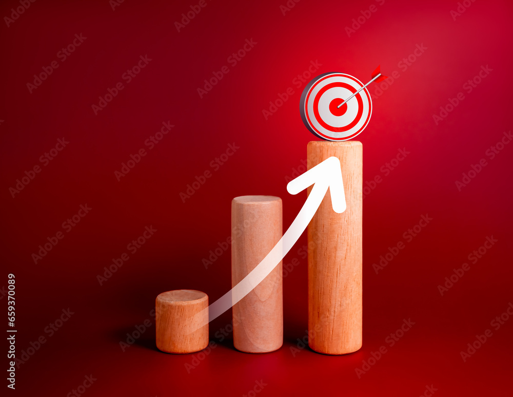 Rising up arrow heading to the 3d target icon on wooden sticks as chart ...