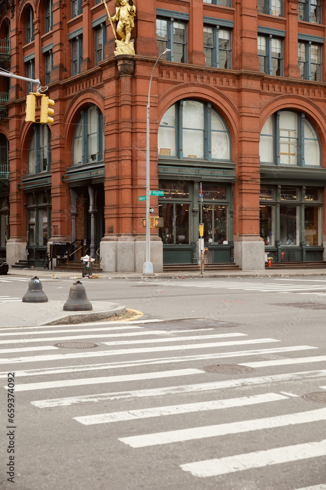famous puck building near pedestrian crossing in manhattan district ...