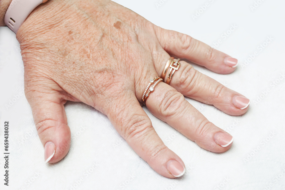 Mature woman hand closeup. Senior skin background. Wrinkled skin on ...