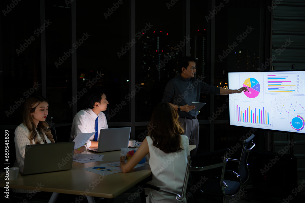 Group of broker international stock traders working actively at night ...