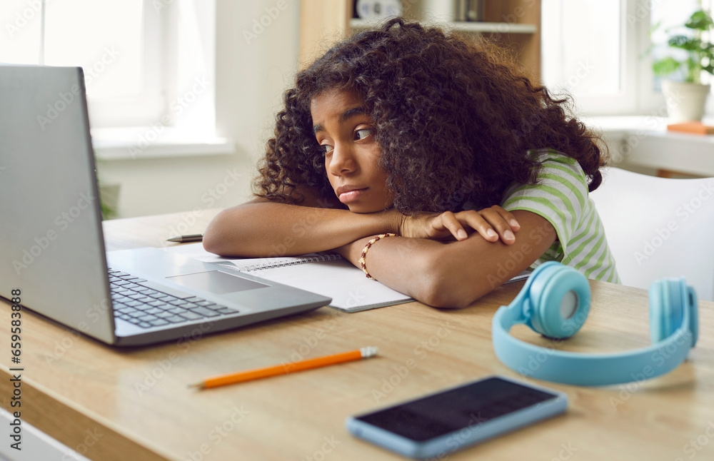 Student gets bored during online lesson. Elementary school child ...